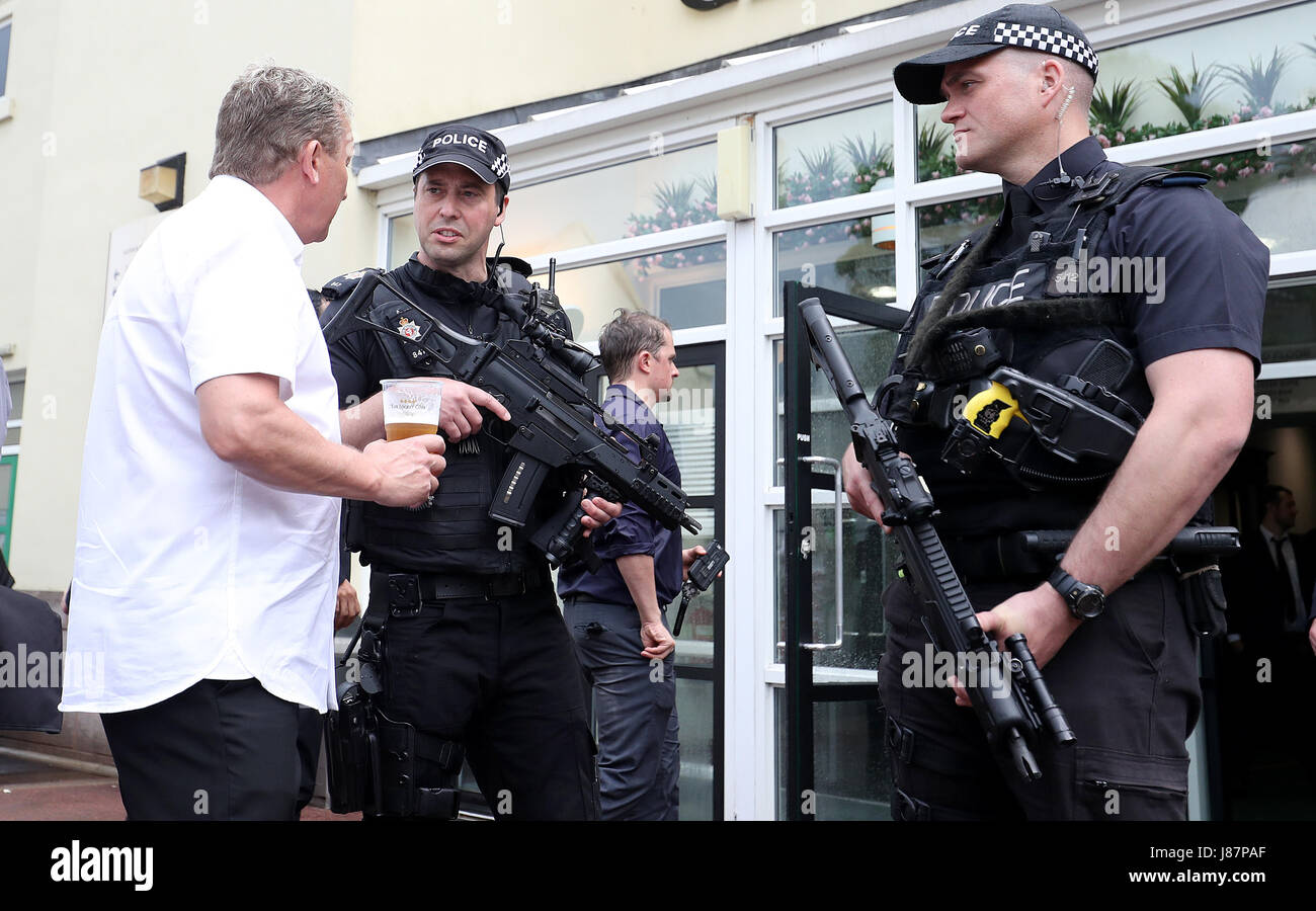 Armed police stand inside Haydock Park Racecourse Stock Photo - Alamy