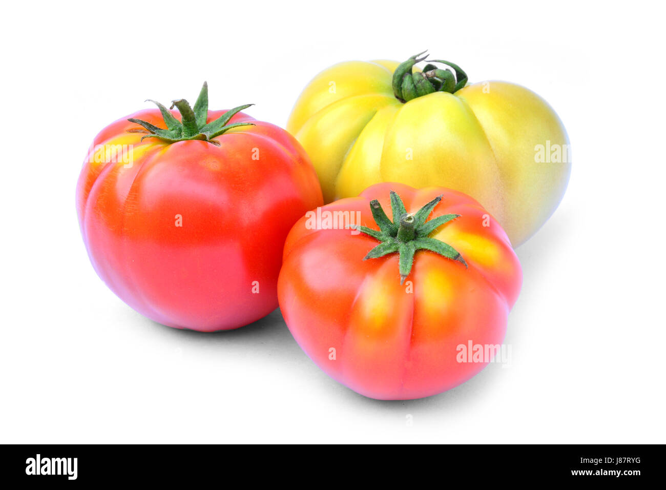 Fresh red and yellow tomato isolated on white background Stock Photo ...