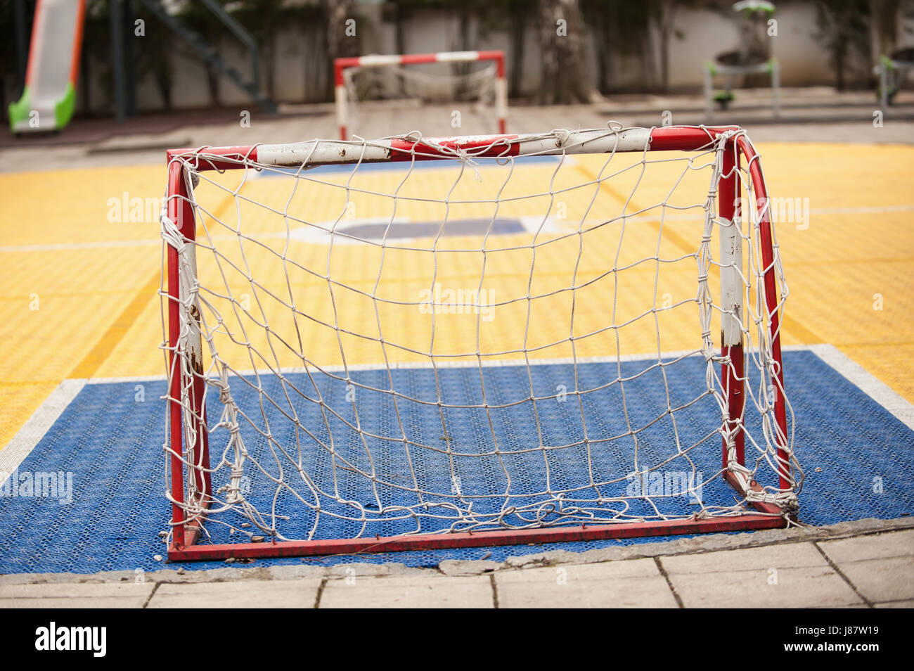 Small soccer field with mini football goal on the children playground ...