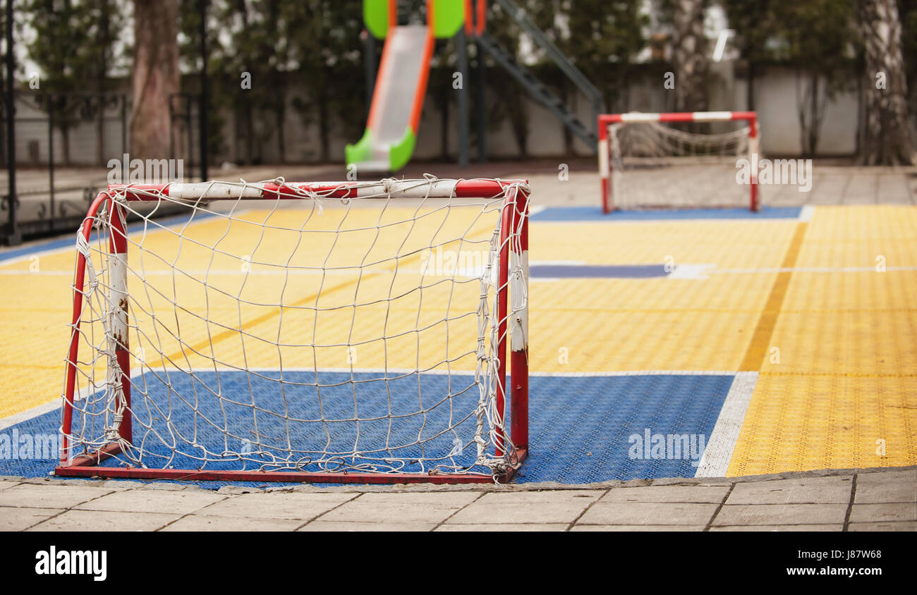 Small soccer field with mini football goal on the children playground ...