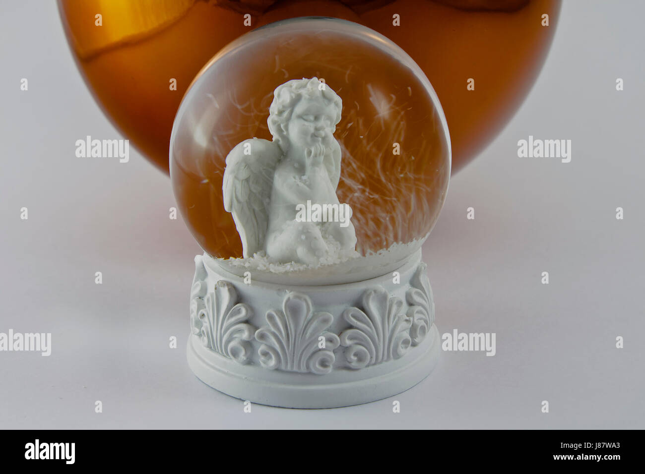 angels in snow globe Stock Photo - Alamy