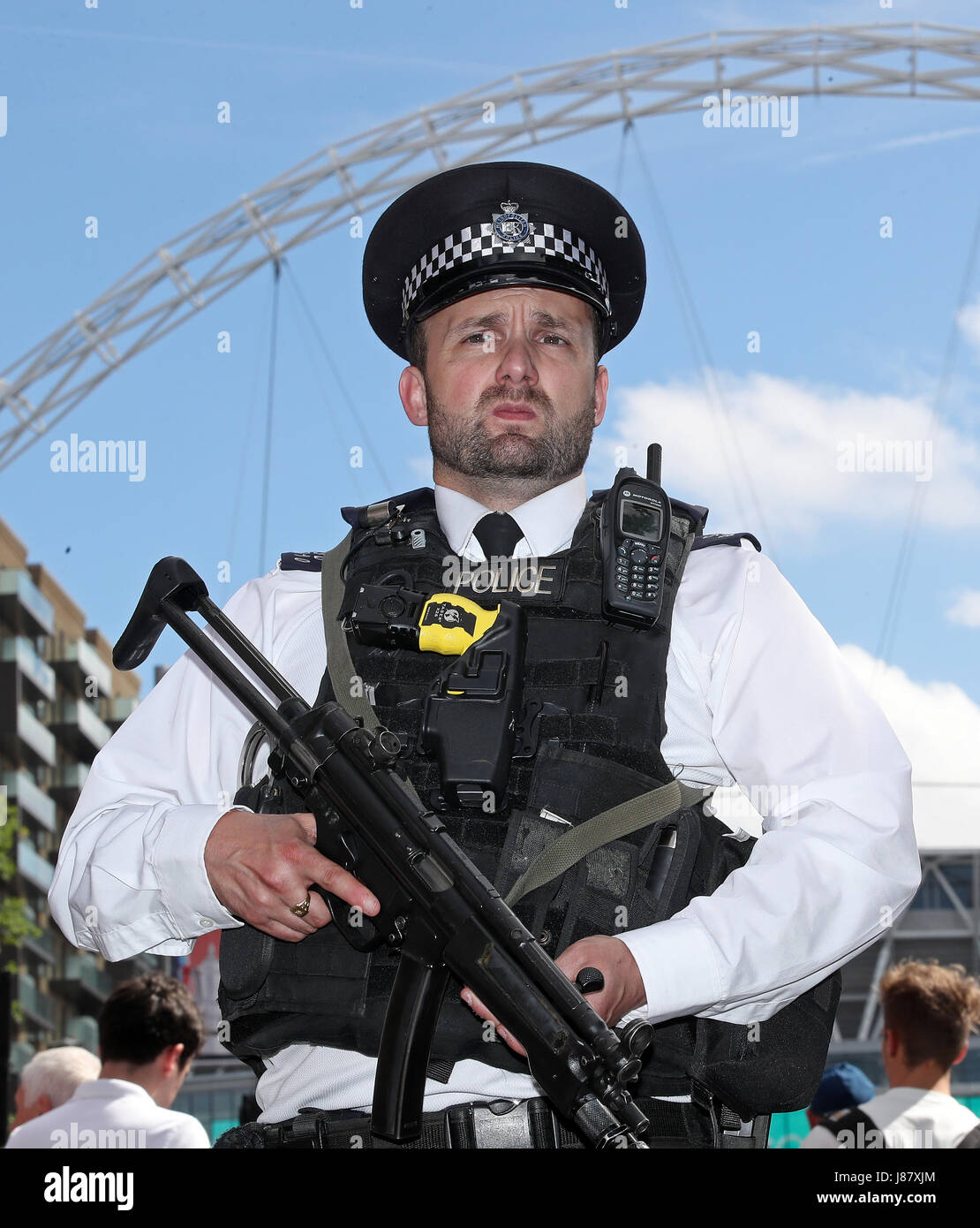 An armed policeman outside the stadium during the Emirates FA Cup Final ...