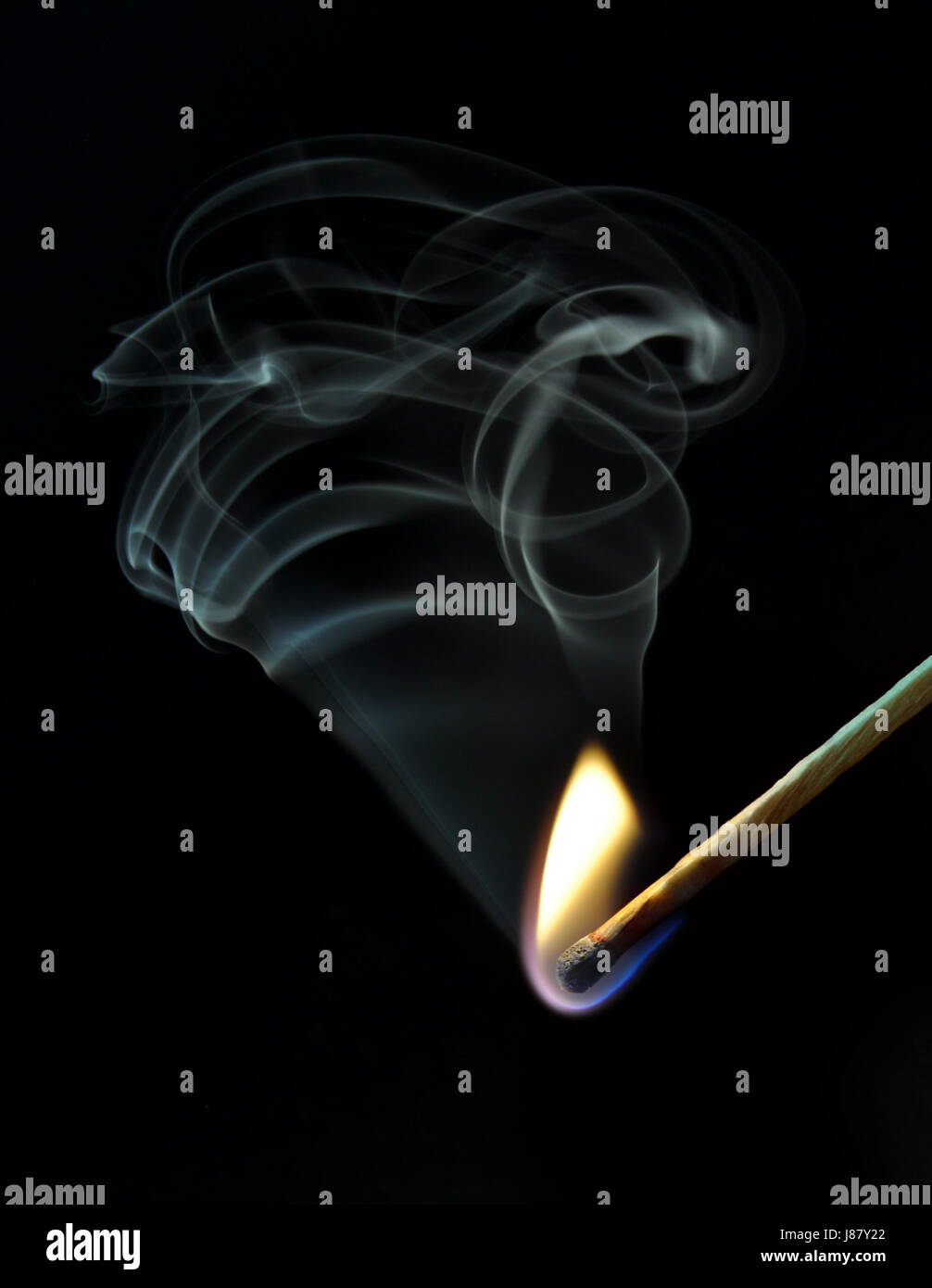 match flame with smoke and black background Stock Photo - Alamy