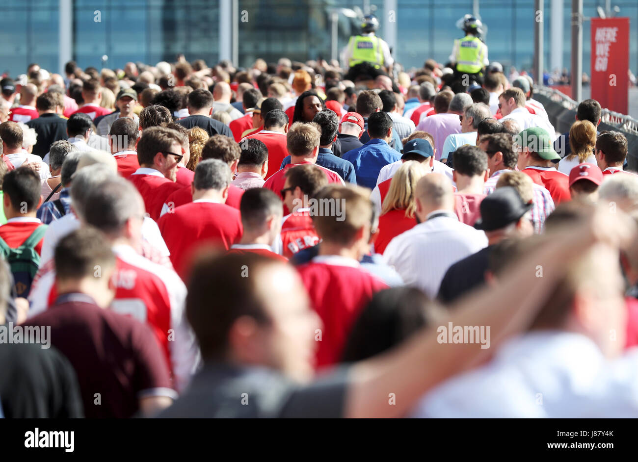Arsenal fans make their way to the stadium before the Emirates FA Cup ...