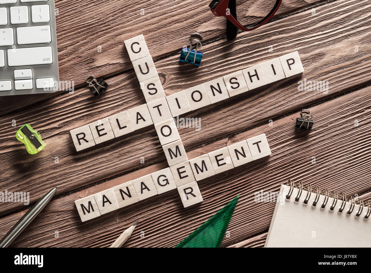 Conceptual business keywords on table with elements of game making ...