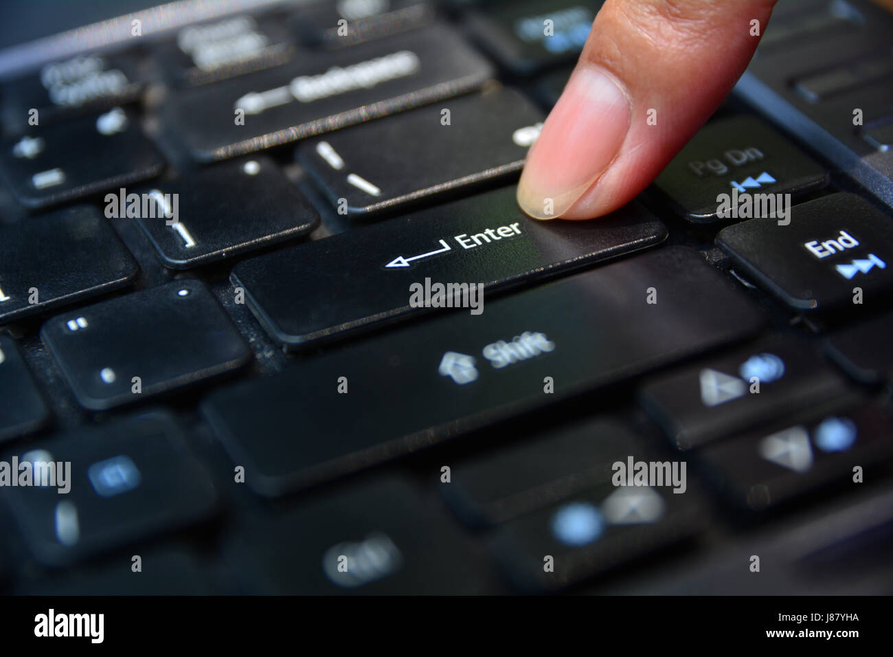 Finger pushing enter button on keyboard. Finger pressing a keyboard ...