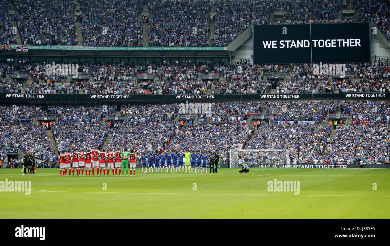 Arsenal and Chelsea players observe a minute's silence in honour of the ...
