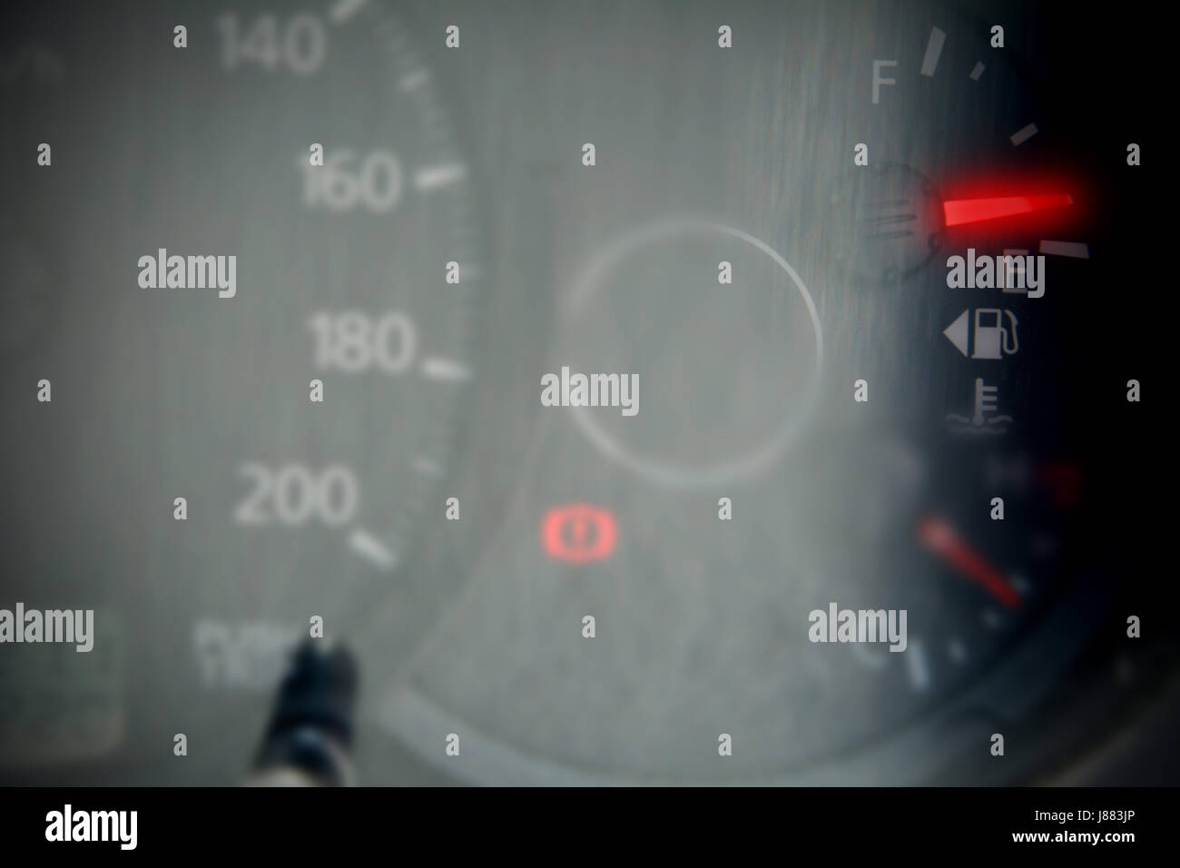 Fuel red gauge showing and almost empty tank Stock Photo - Alamy