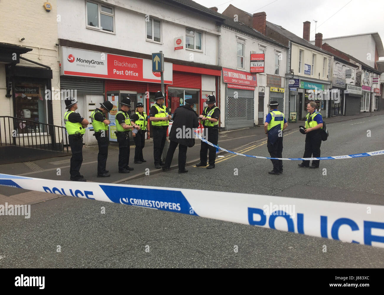 A police cordon near a Sainsbury's in Blackheath, West Midlands, after ...