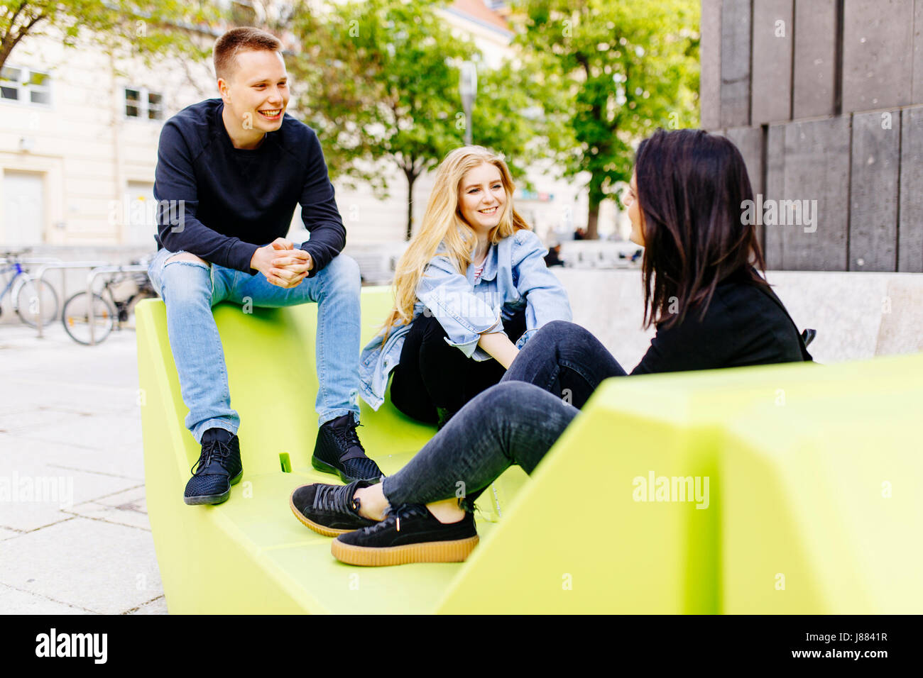 Group of friends talking lounge hi-res stock photography and images - Alamy