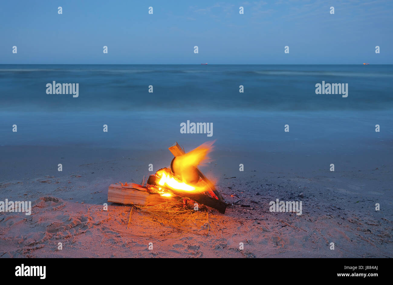 Fire on the beach Stock Photo - Alamy