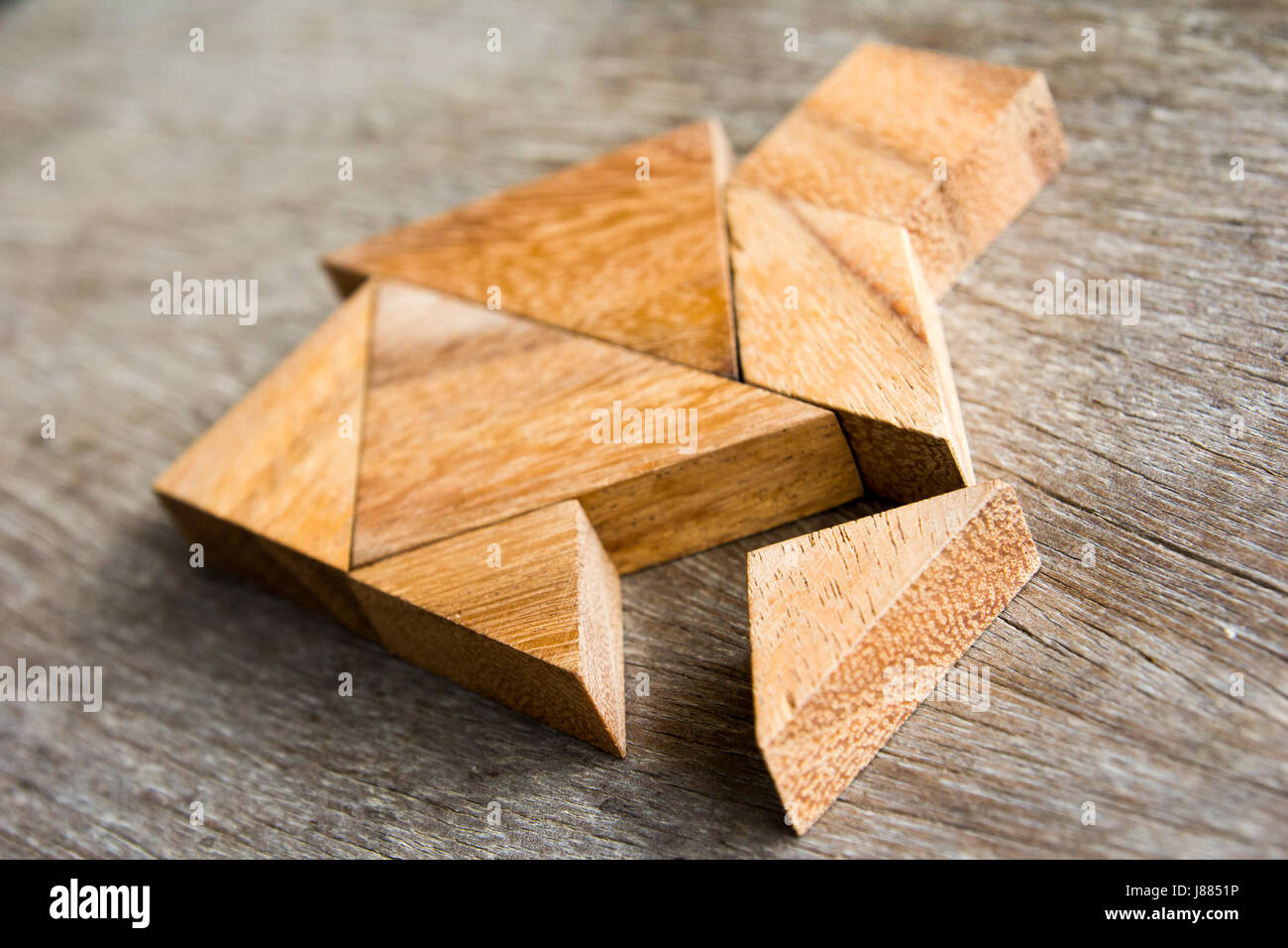 Wooden tangram puzzle wait to fulfill home shape for build dream home ...