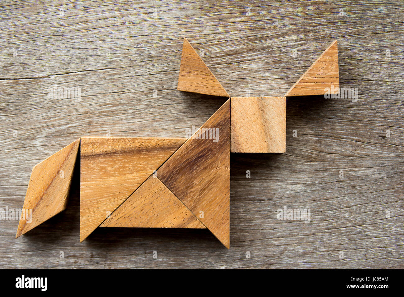 Wooden tangram puzzle in buffalo or bull shape background Stock Photo ...