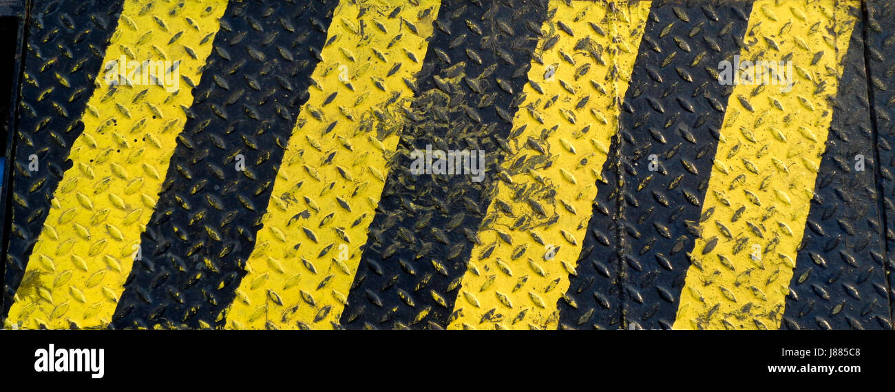 Black and yellow line paint on non-slip metal background Stock Photo ...