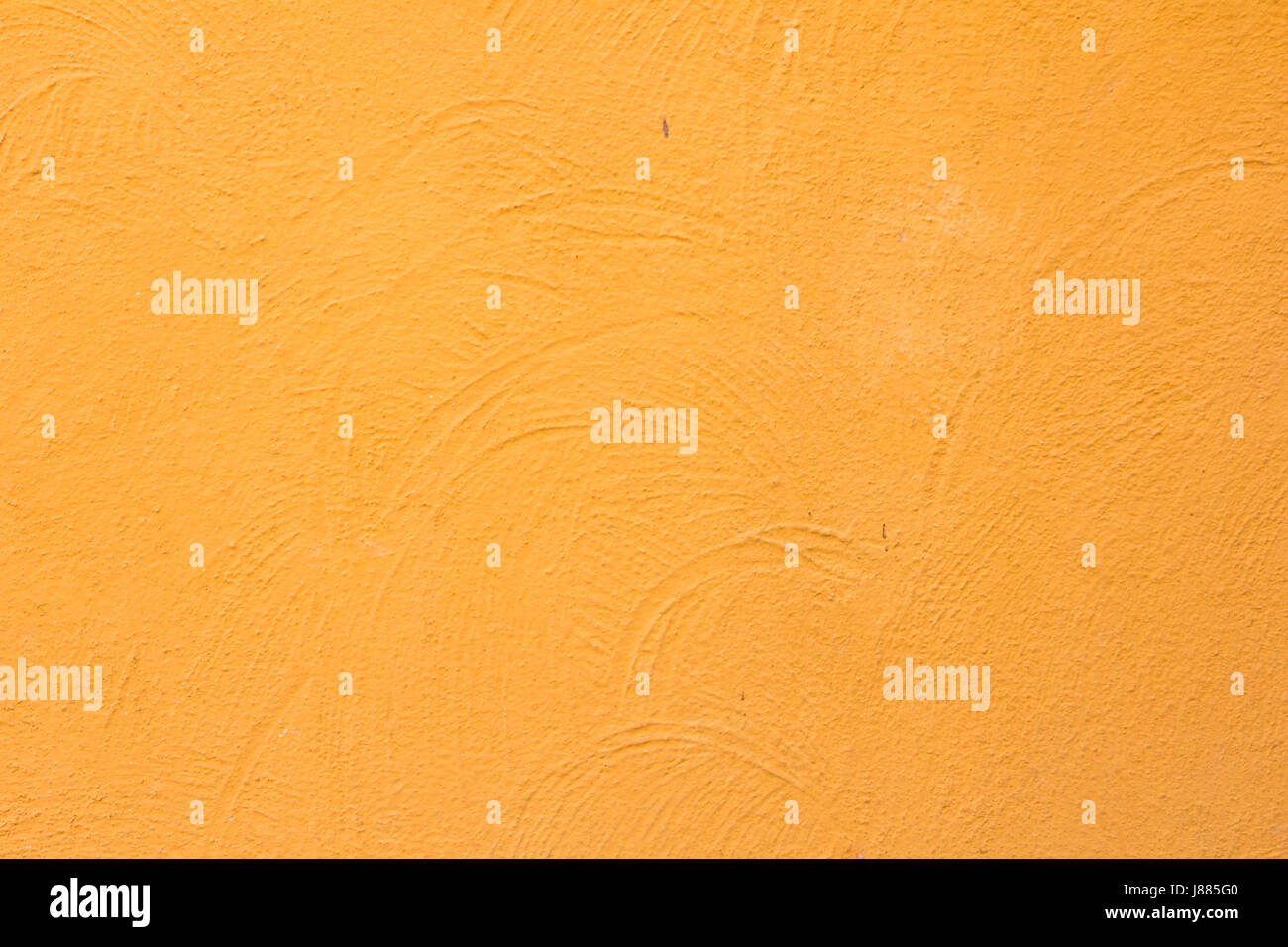 Orange color concrete wall background Stock Photo - Alamy