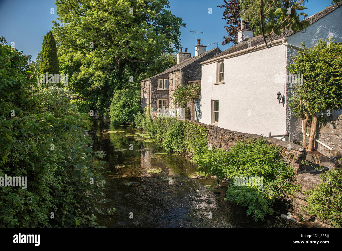 The river Eea in Cartmel village in the Lake district historically ...