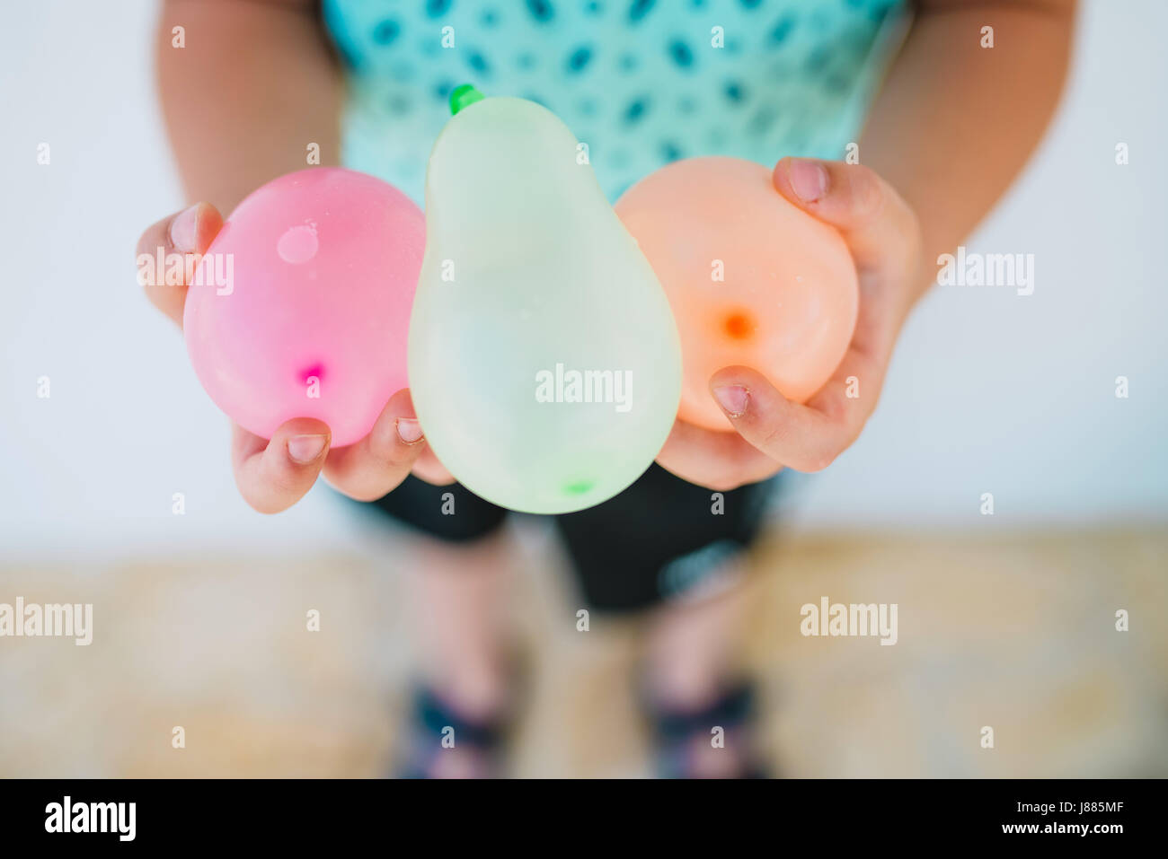 Water balloon fight kid hi-res stock photography and images - Alamy