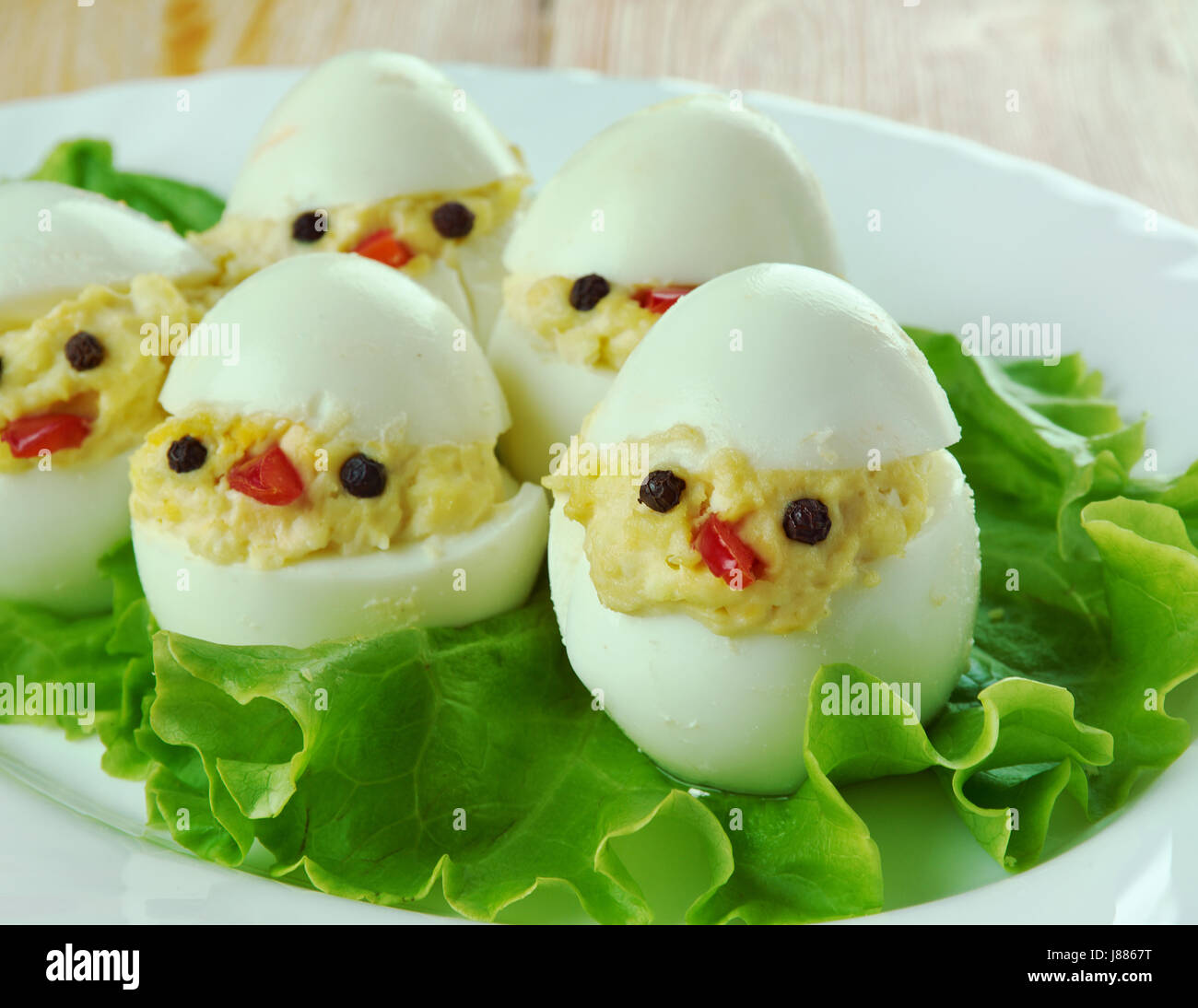 creative food concept - Brood of chickens, made from eggs, sauce and ...