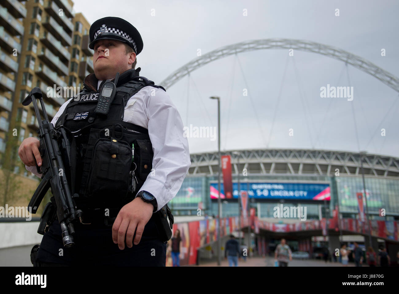 Armed police officers patrol outside Wembley Stadium following the FA ...