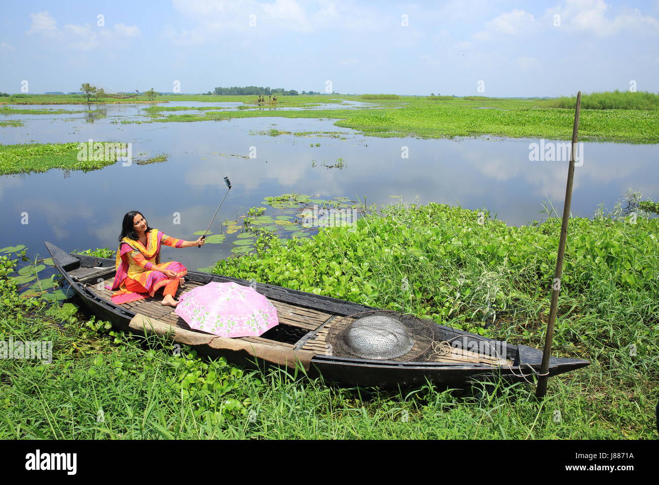 Young woman taking selfie at Arial Beel in Sreenagar, Munshiganj ...