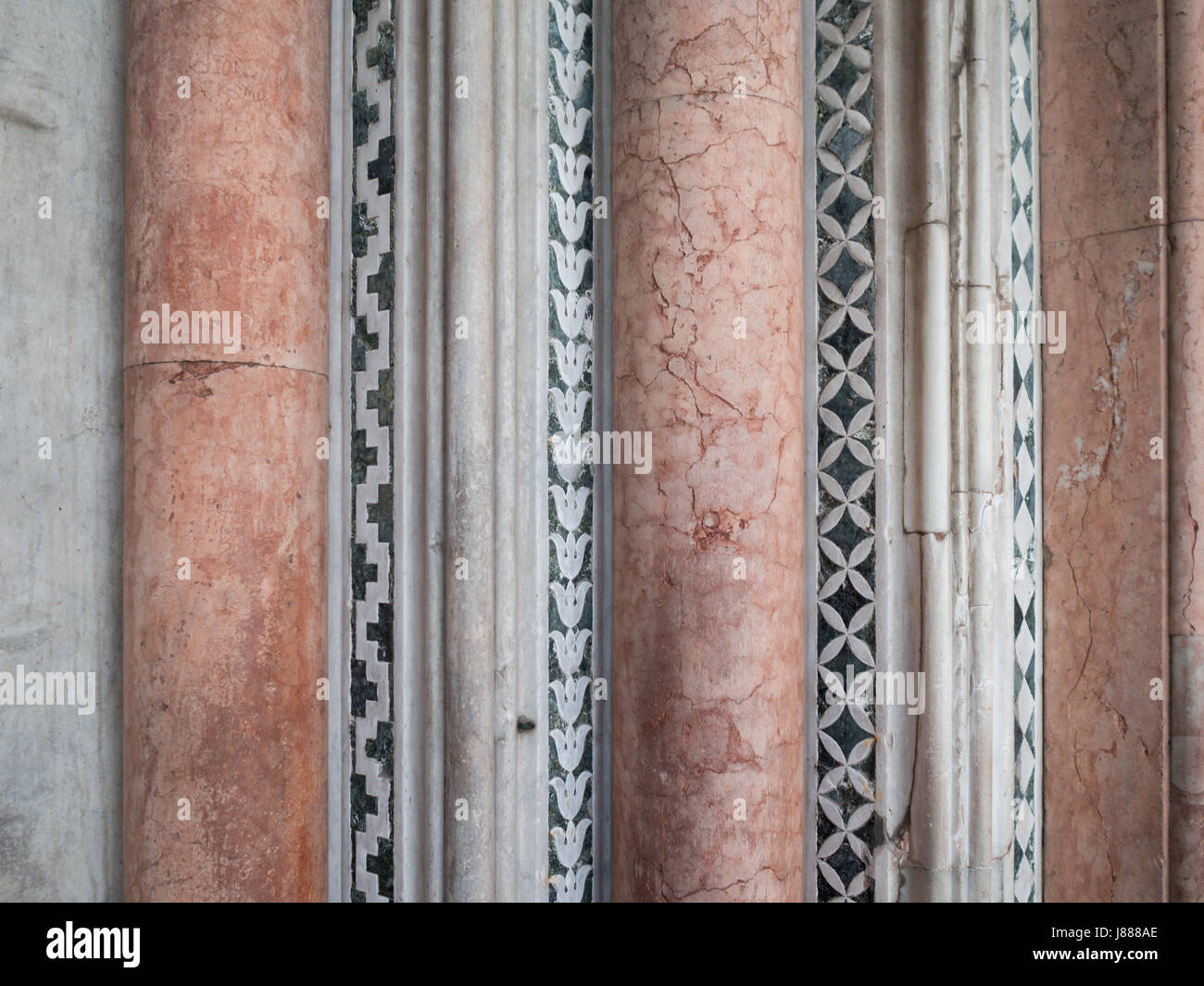 Polychromatic stone work detail from Lucca Duomo door Stock Photo - Alamy