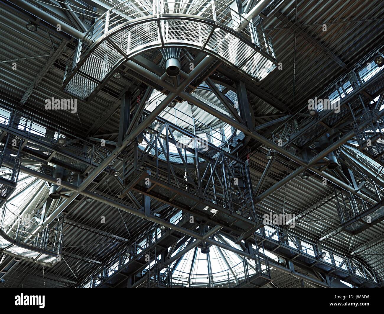 Metal platform construction on the roof of a warehouse, ladders ...