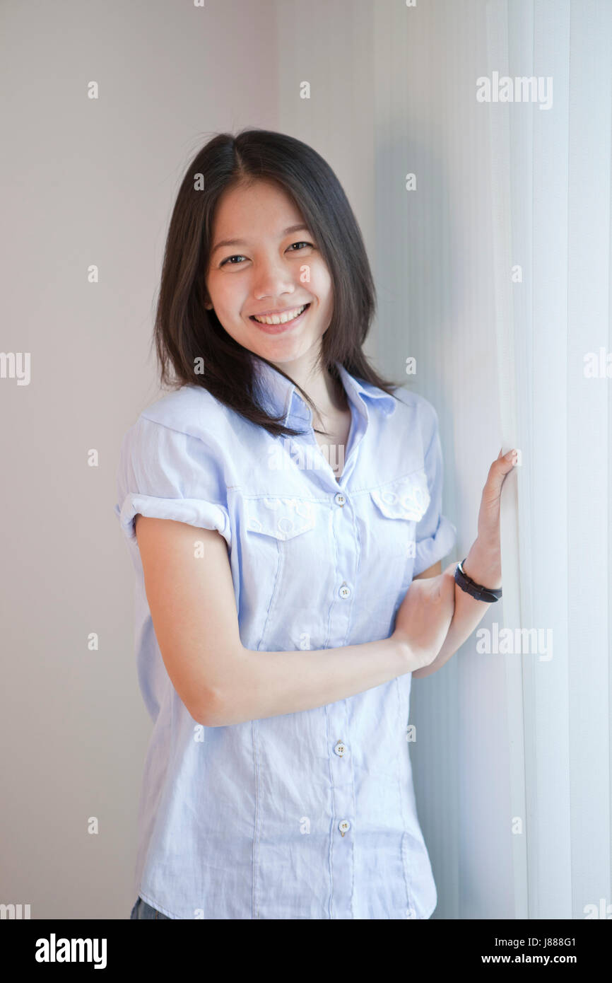 natural face with no make up of asian teen and smiling to camera Stock ...