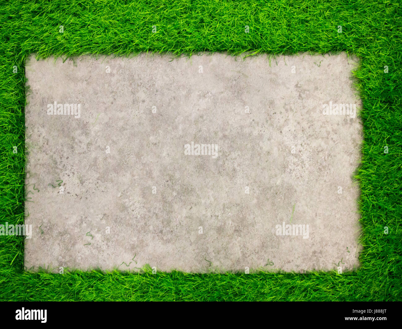 Square concrete plate on artificial green grass background Stock Photo ...