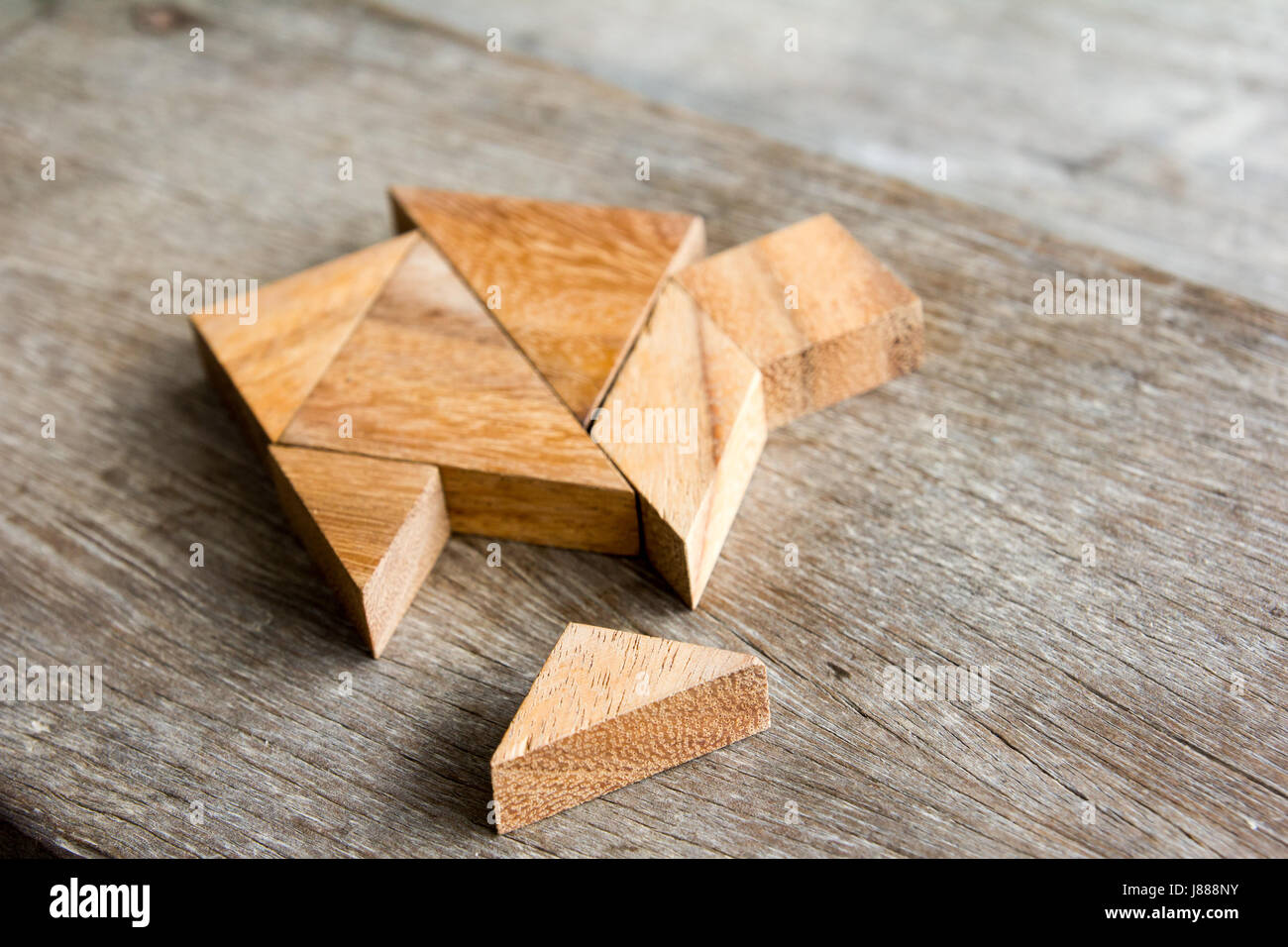Wooden tangram puzzle wait to fulfill home shape for build dream home ...