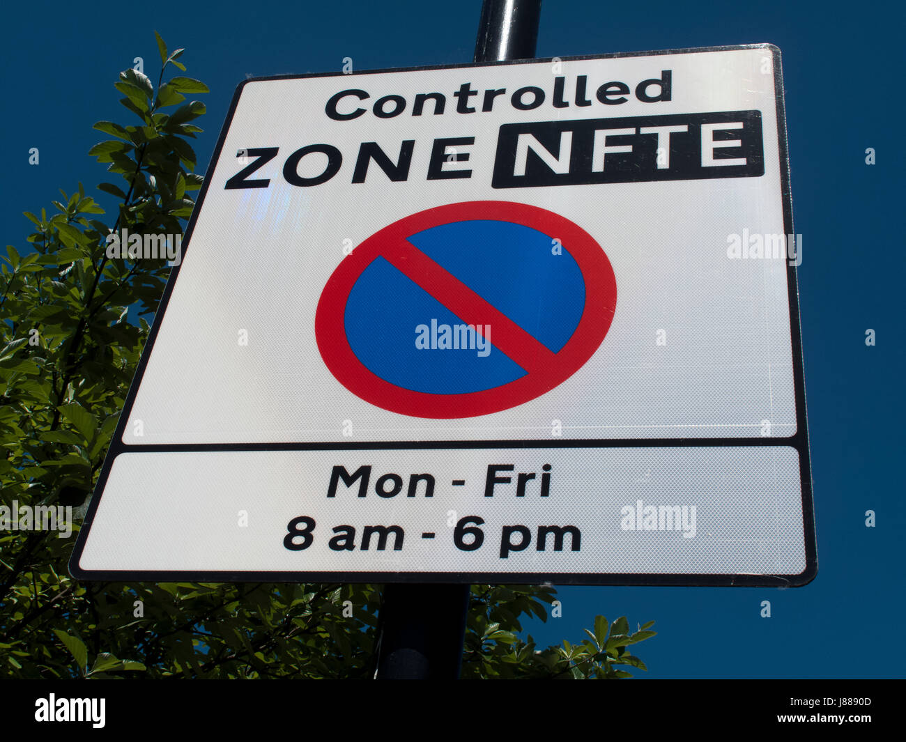 Controlled zone sign showing car parking restrictions between Monday ...