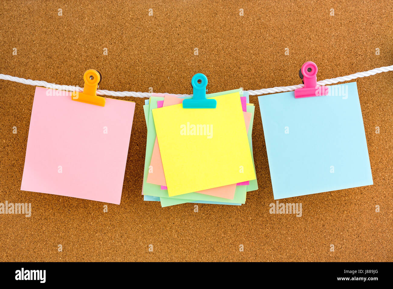 Blank notes with Letter Clips on cork bulletin board Stock Photo - Alamy