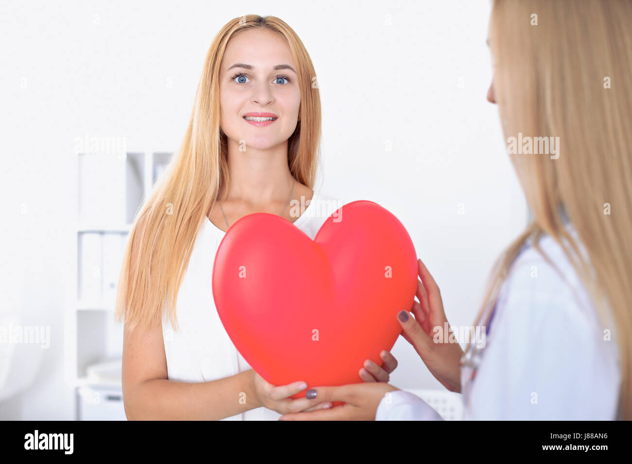 Doctor heart and patient in hospital. Medicine and health care concept ...