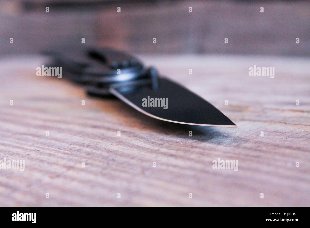Black knife. View of the blade of the knife at an angle Stock Photo - Alamy