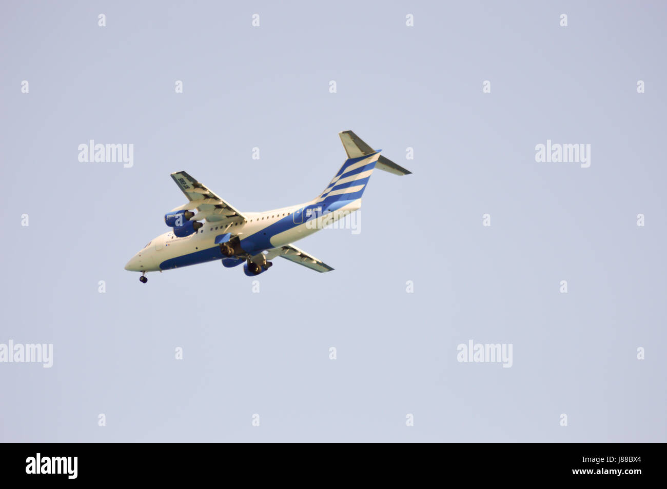 Plane in Greek colors on landing on the island of Crete Stock Photo - Alamy