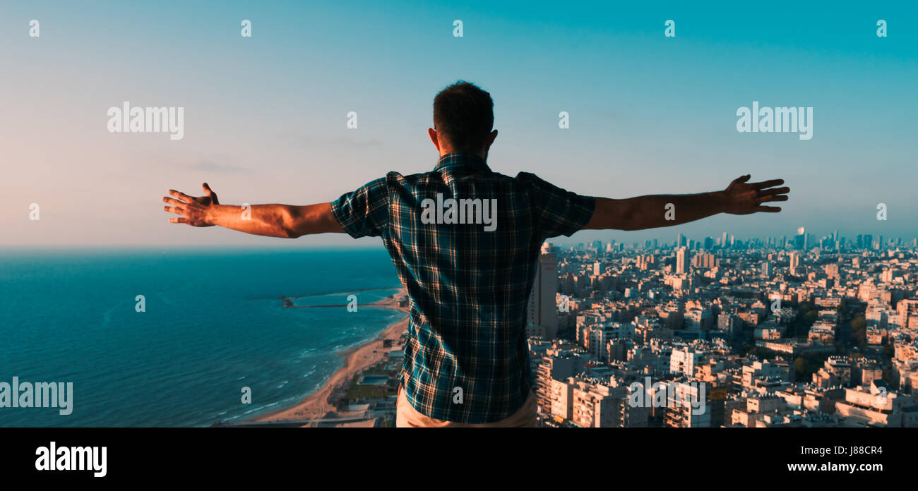 Man standing above city Stock Photo - Alamy
