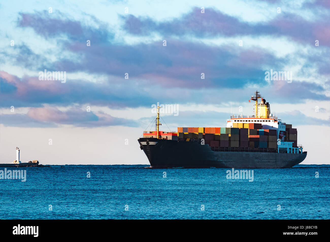 Modern black container ship moving from Baltic sea Stock Photo - Alamy