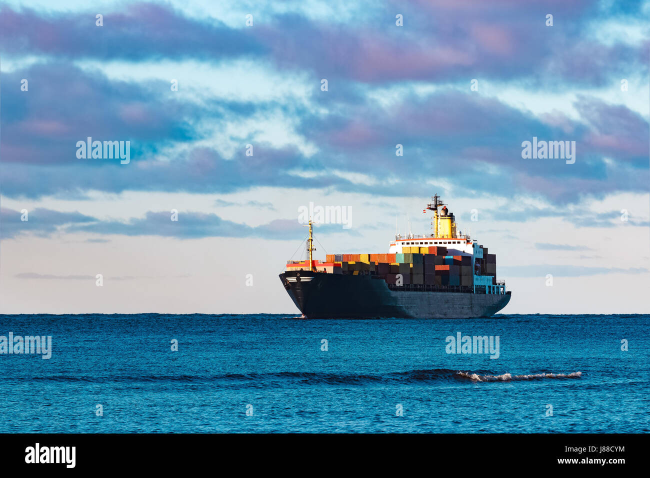 Modern black container ship moving from Baltic sea Stock Photo - Alamy
