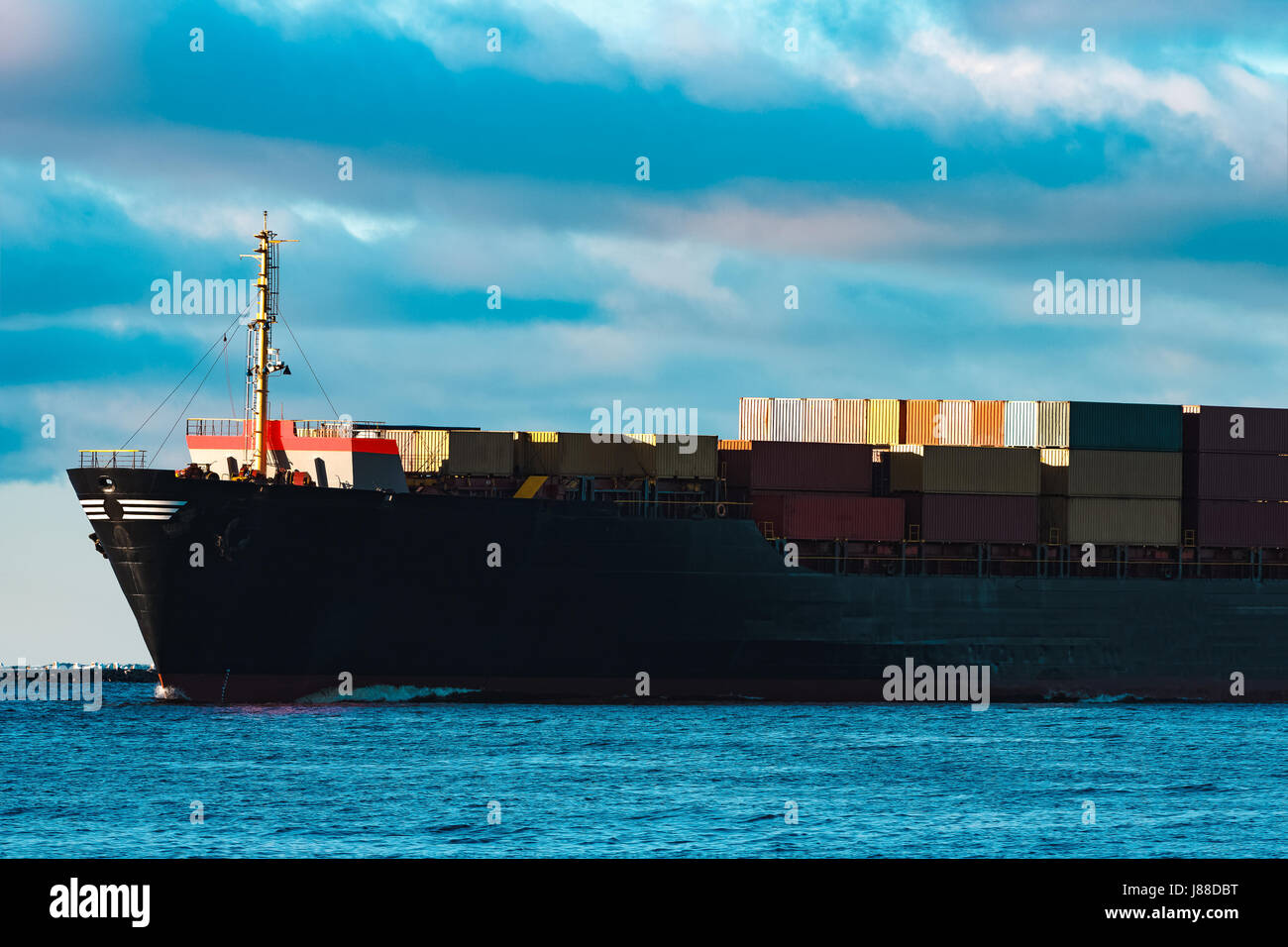 Modern black container ship moving from Baltic sea Stock Photo - Alamy