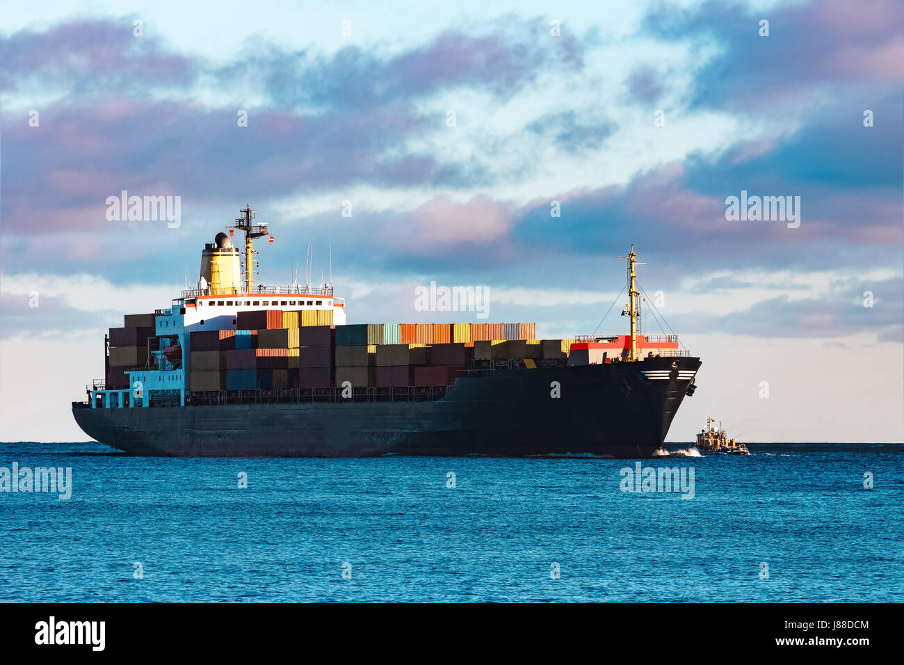 Modern black container ship moving from Baltic sea Stock Photo - Alamy