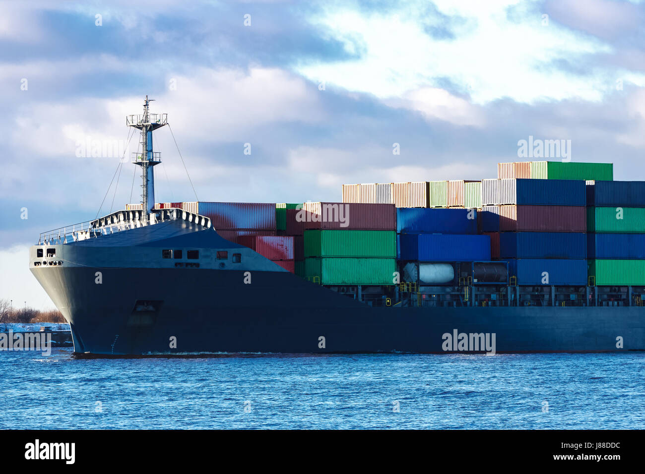 Modern grey container ship moving in still water Stock Photo - Alamy