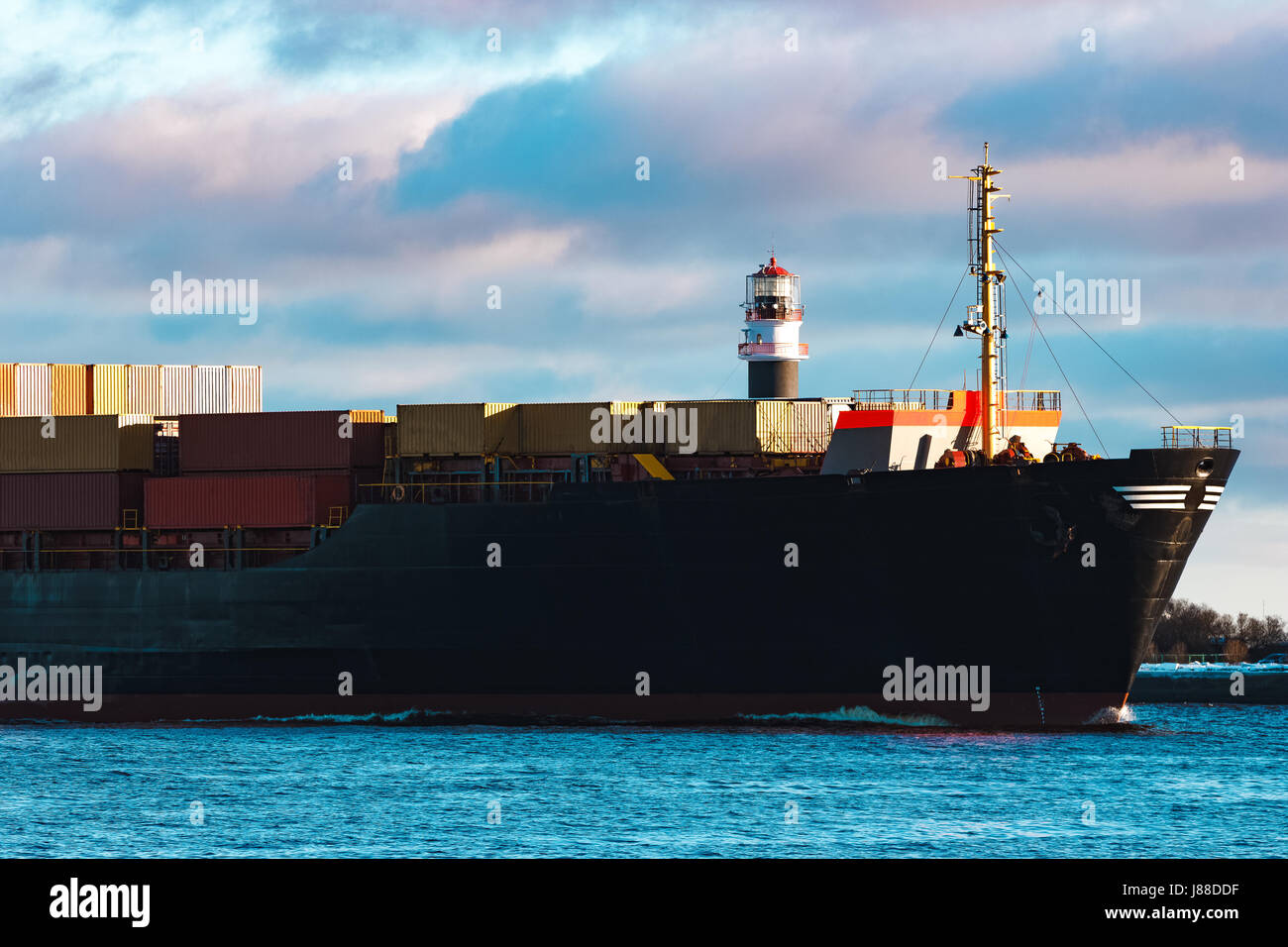 Modern black container ship moving from Baltic sea Stock Photo - Alamy