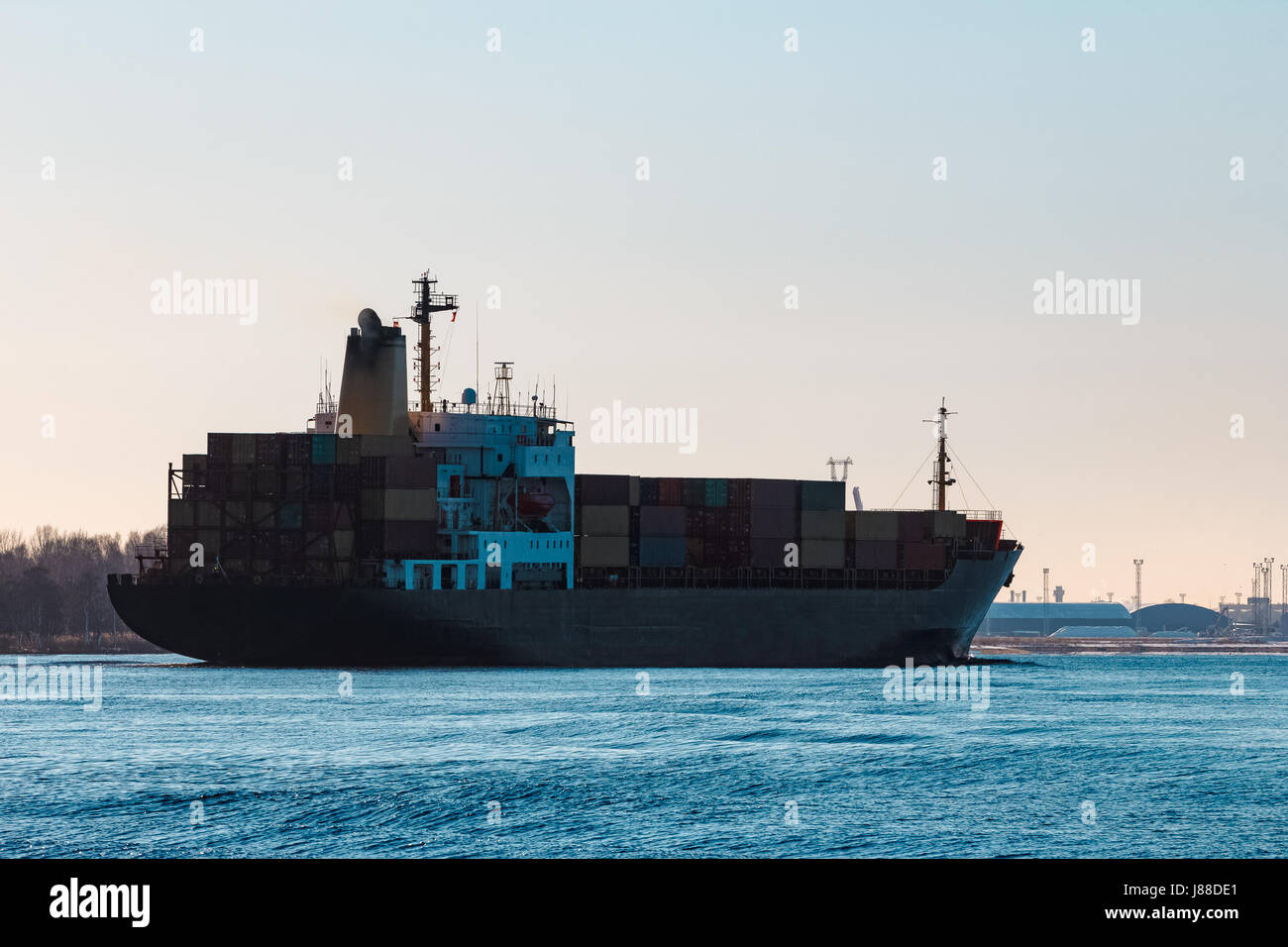 Modern black container ship moving from Baltic sea Stock Photo - Alamy