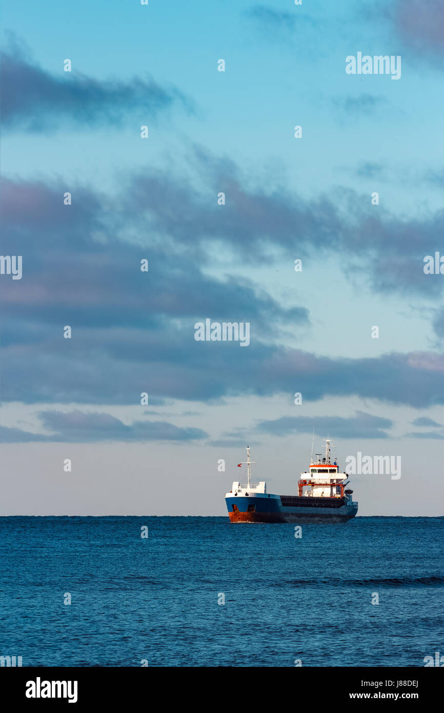 Blue bulk carrier sailing in still water Stock Photo - Alamy