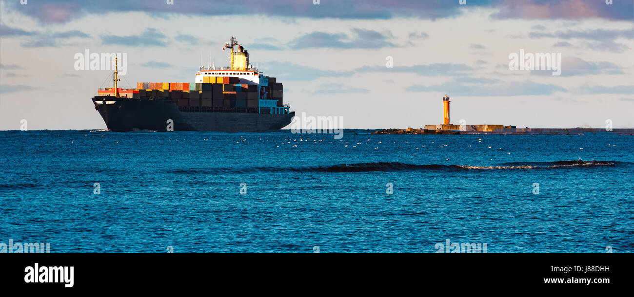 Modern black container ship moving from Baltic sea Stock Photo - Alamy