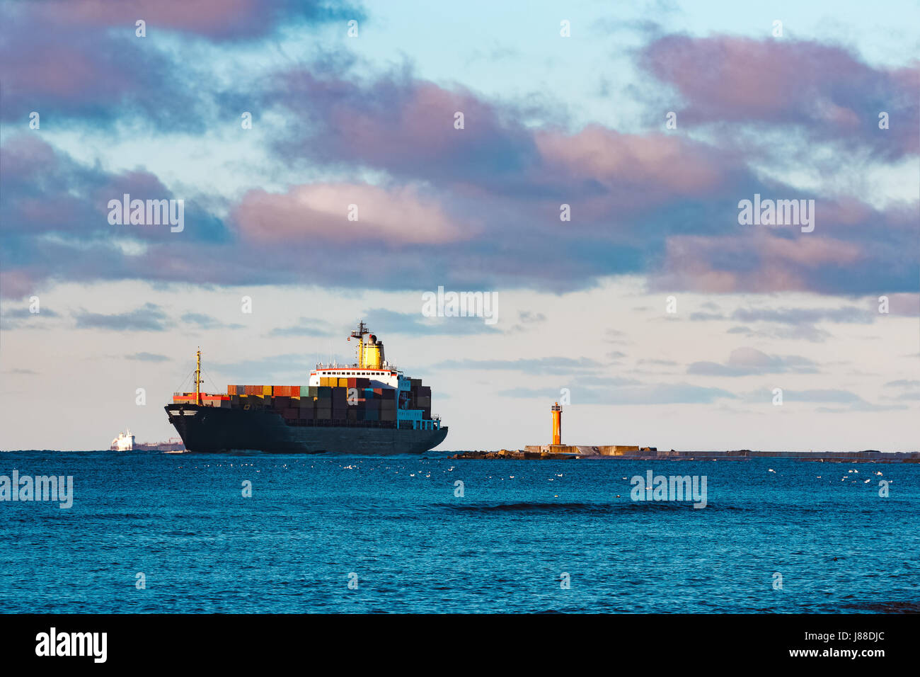 Modern black container ship moving from Baltic sea Stock Photo - Alamy