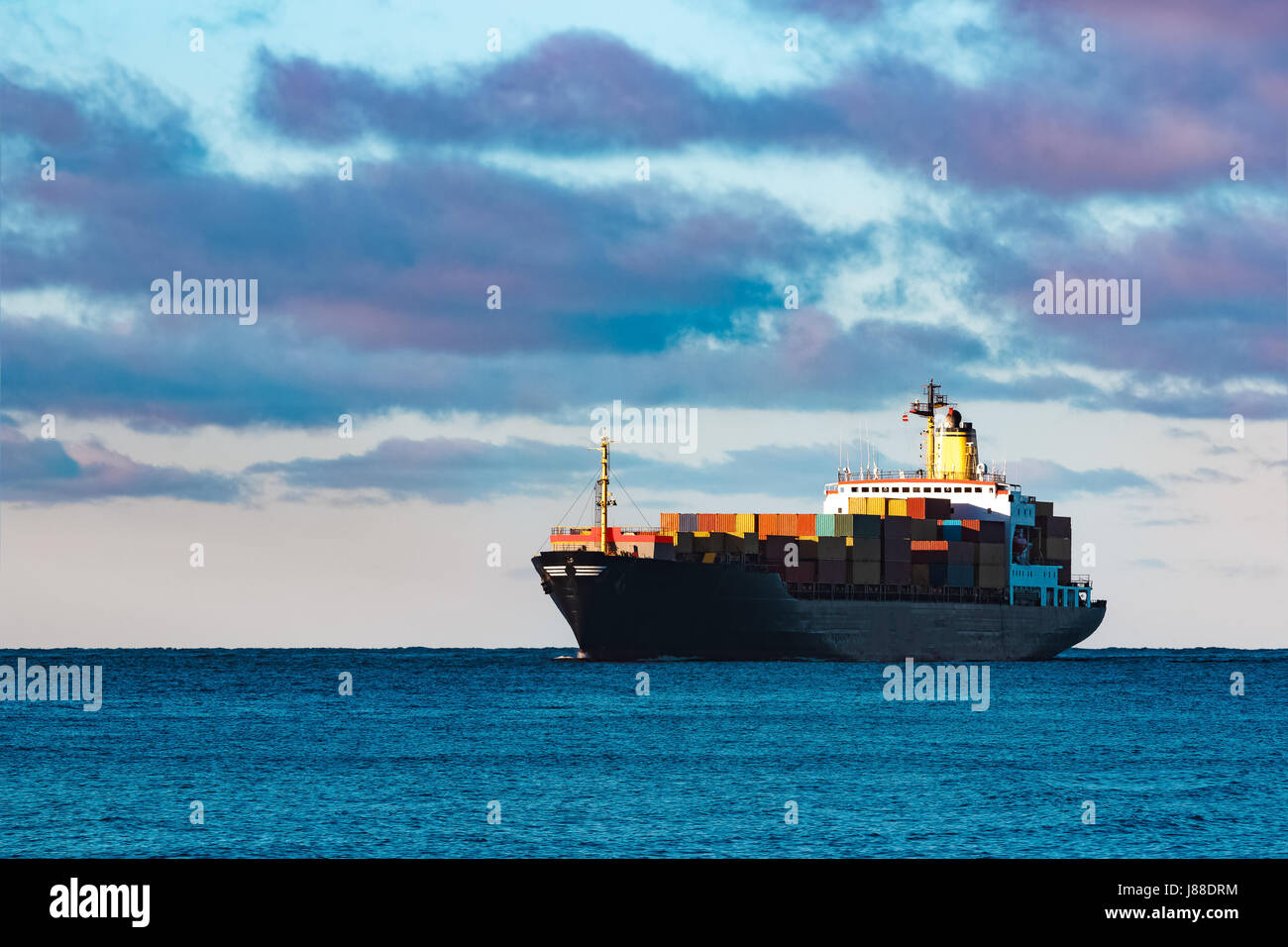 Modern black container ship moving from Baltic sea Stock Photo - Alamy