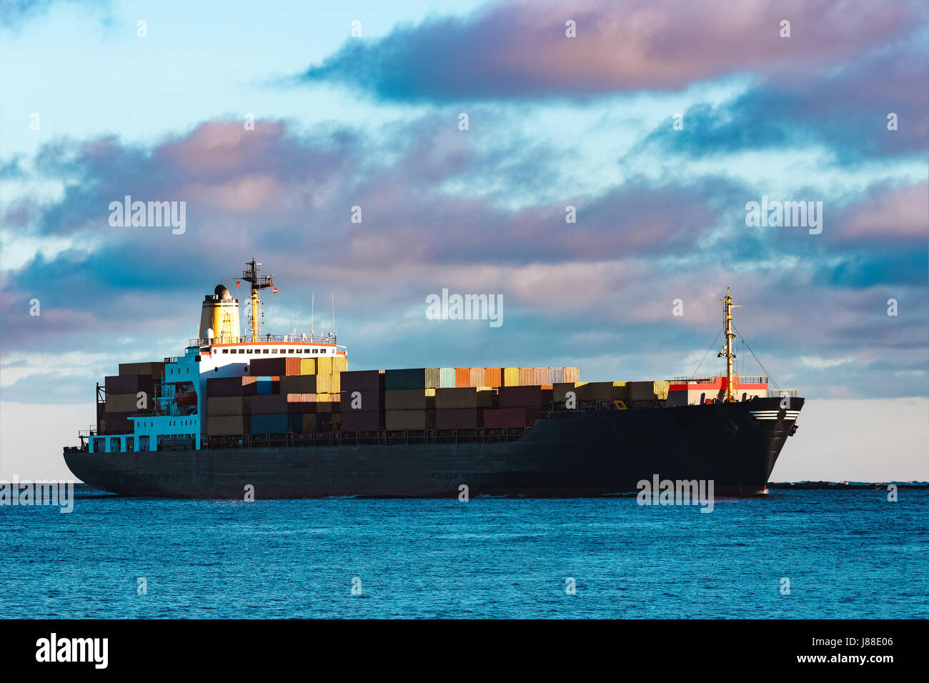 Modern black container ship moving from Baltic sea Stock Photo - Alamy
