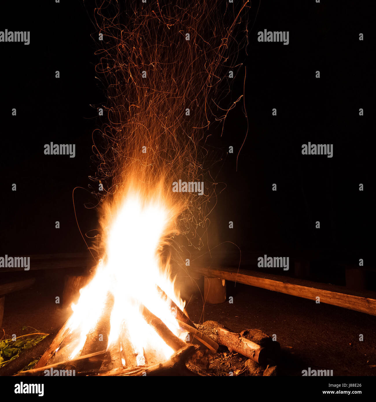 Campfire with flying sparks in the night Stock Photo - Alamy