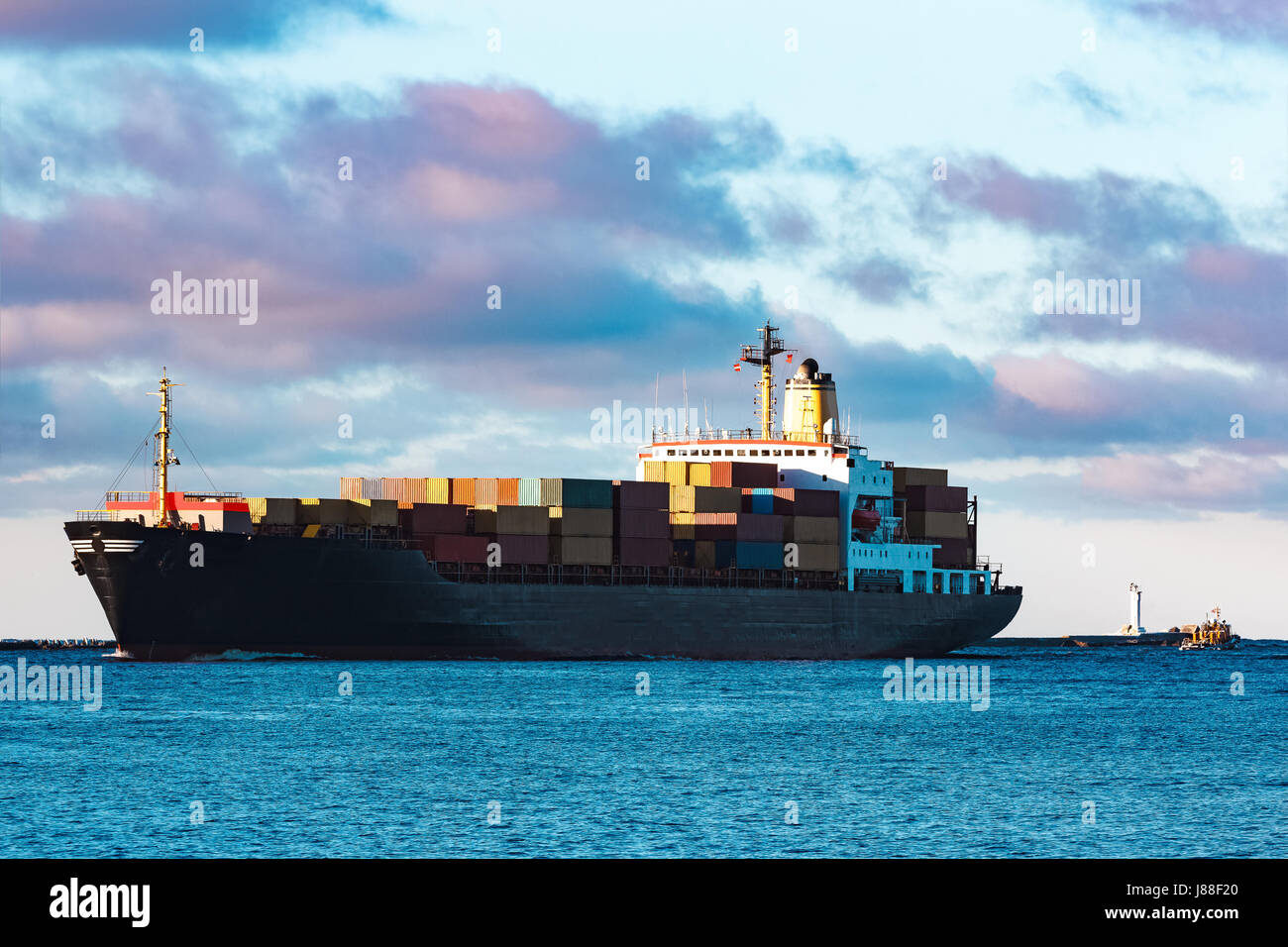 Modern black container ship moving from Baltic sea Stock Photo - Alamy