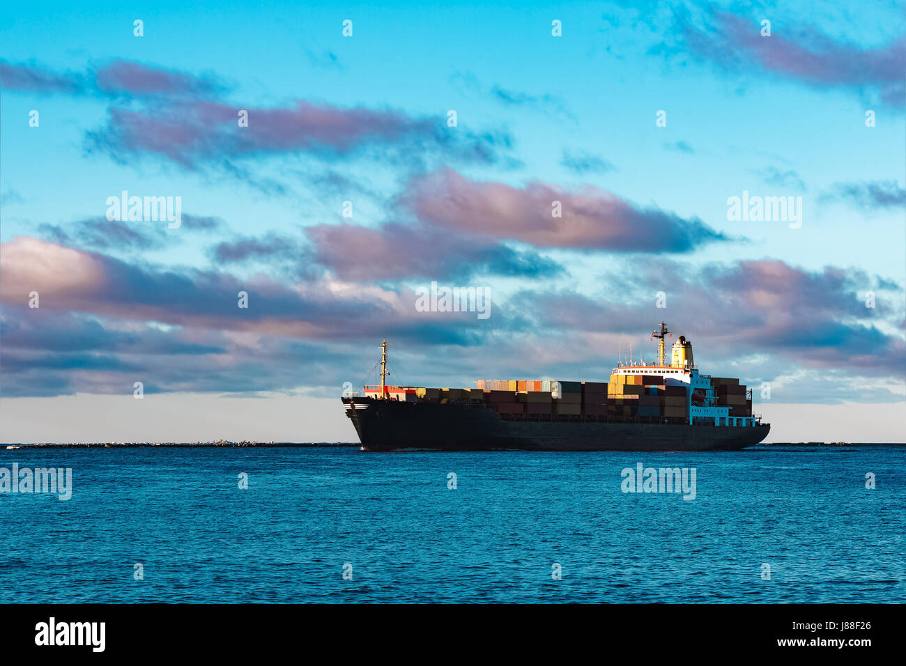 Modern black container ship moving from Baltic sea Stock Photo - Alamy